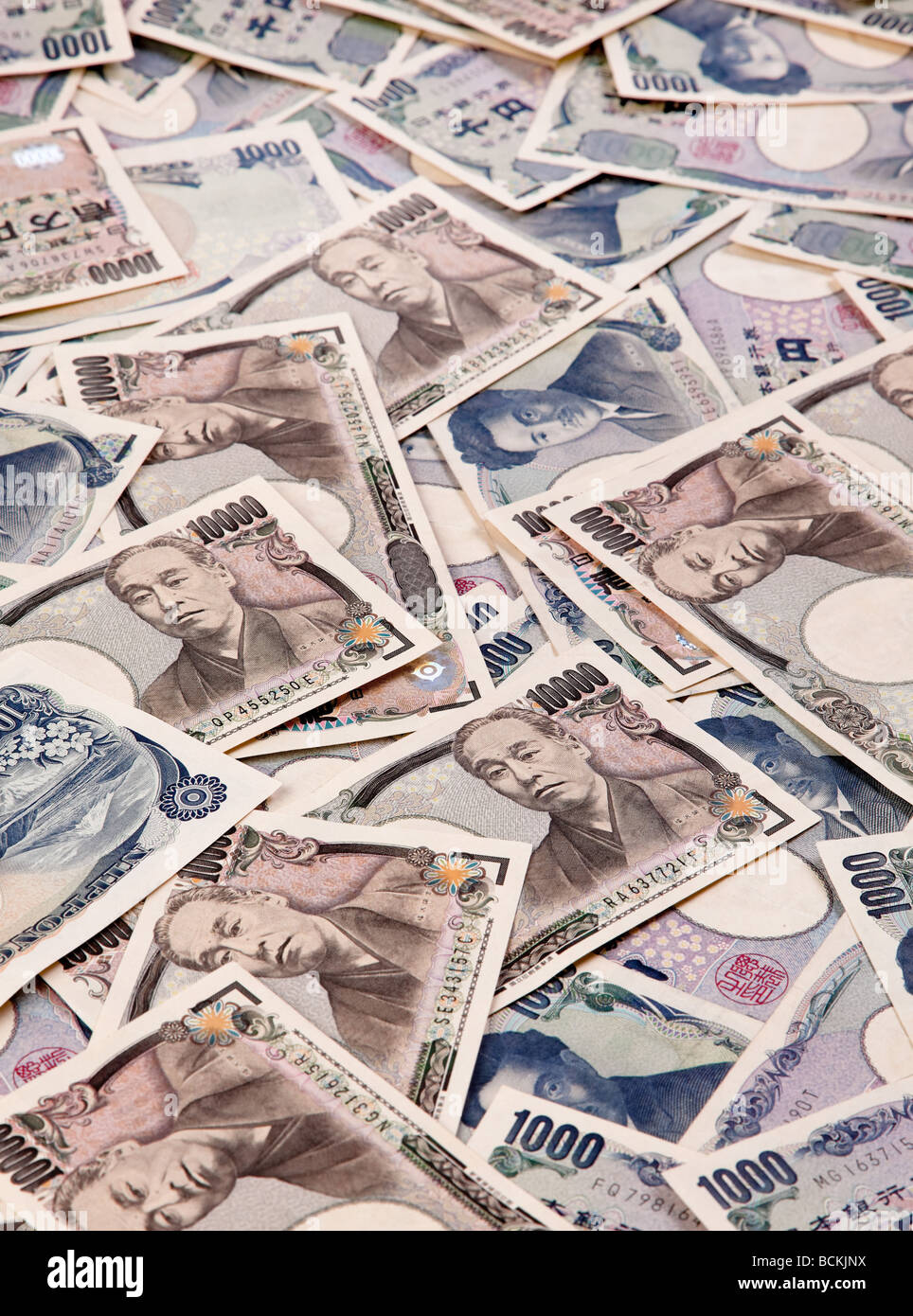 Many Japanese Yen banknotes of Yen currency Stock Photo - Alamy