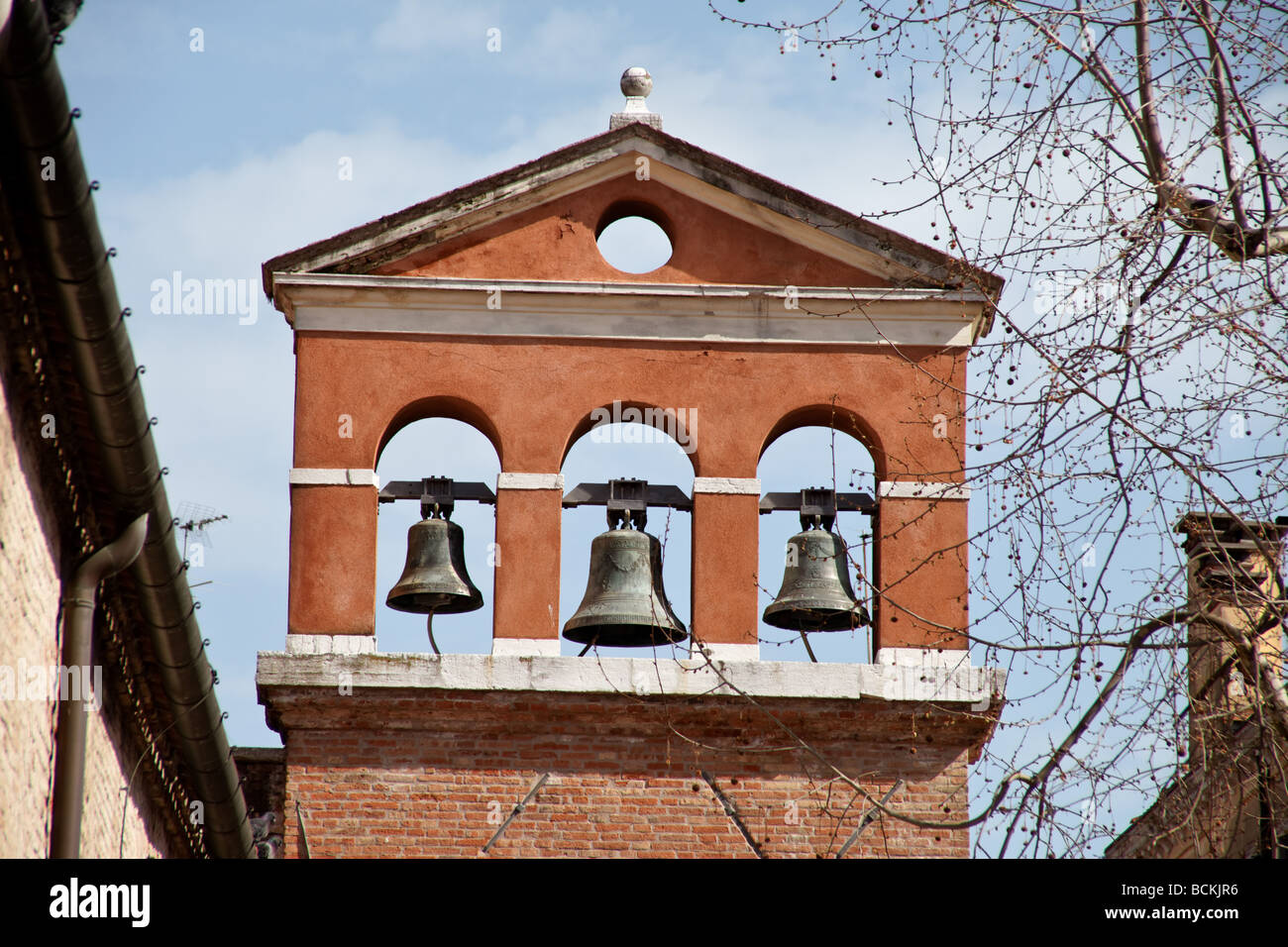 Open bell tower with three bells in Italy Stock Photo - Alamy