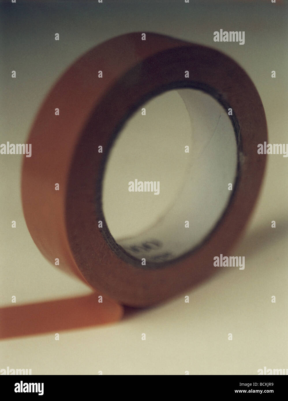 Roll of red tape Stock Photo - Alamy