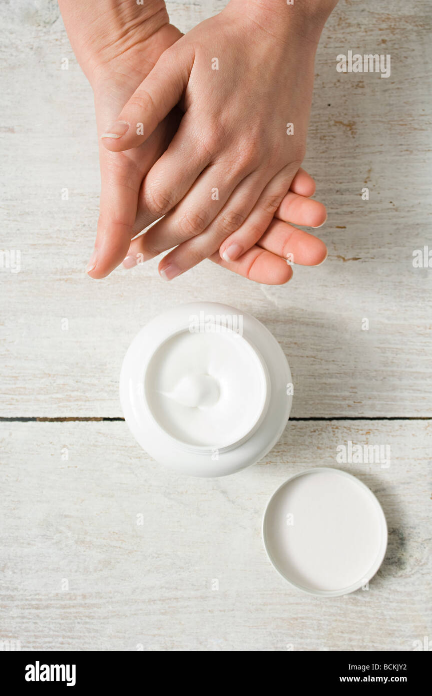 Woman using moisturizing hand cream hi-res stock photography and images ...