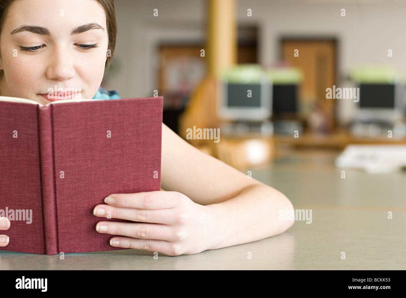 Girl reading a book Stock Photo - Alamy