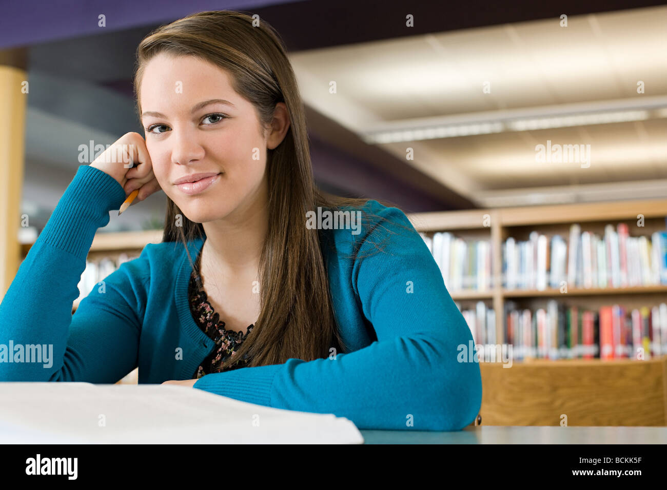 Teenager revising library hi-res stock photography and images - Alamy