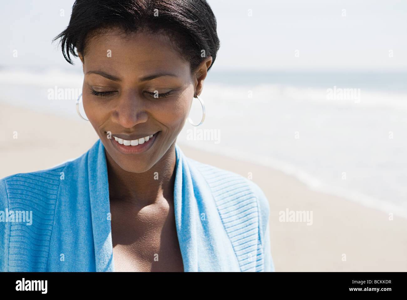 African american woman on a beach Stock Photo - Alamy