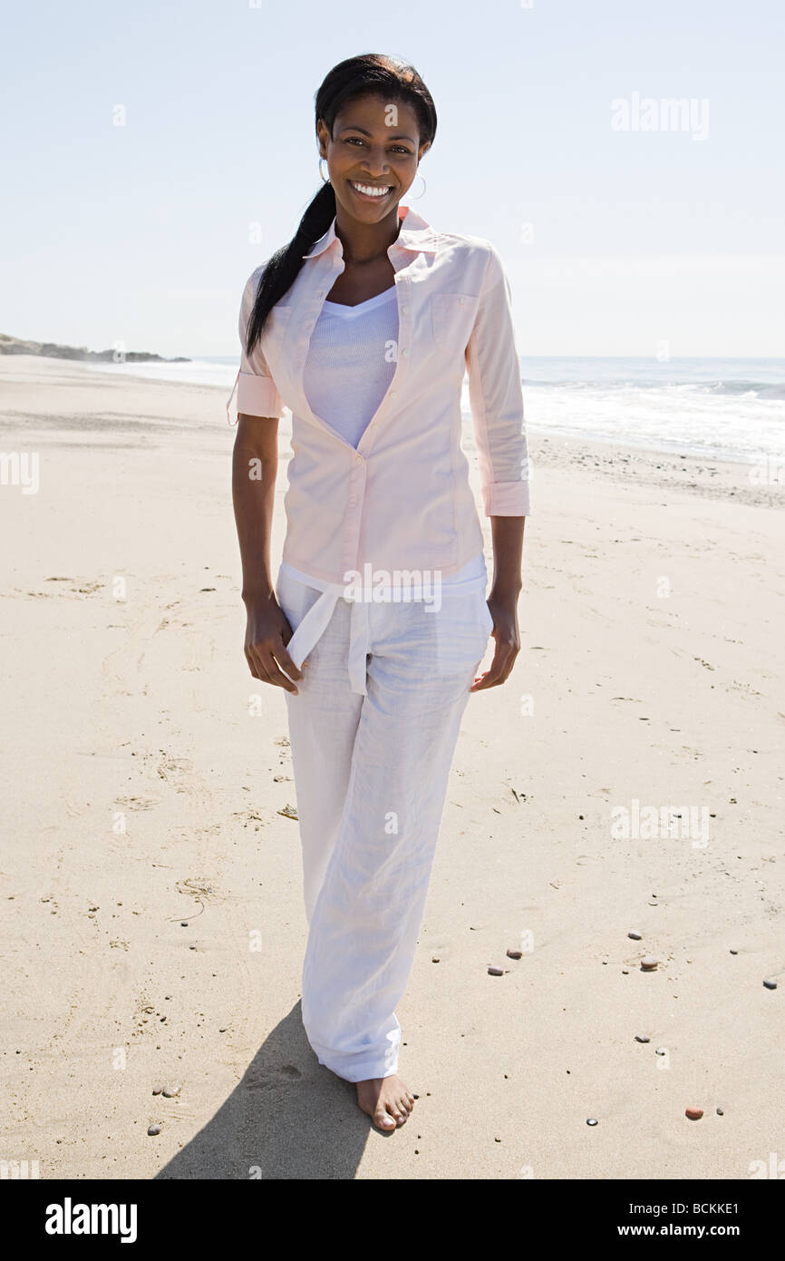 Single female on a beach hi-res stock photography and images - Alamy