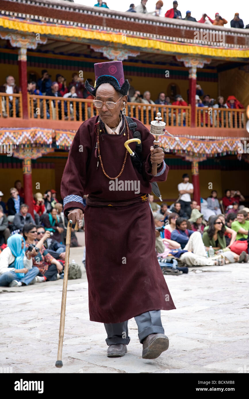 Buddhist monk spinning a prayer wheel. Hemis Gompa festival. Ladakh ...