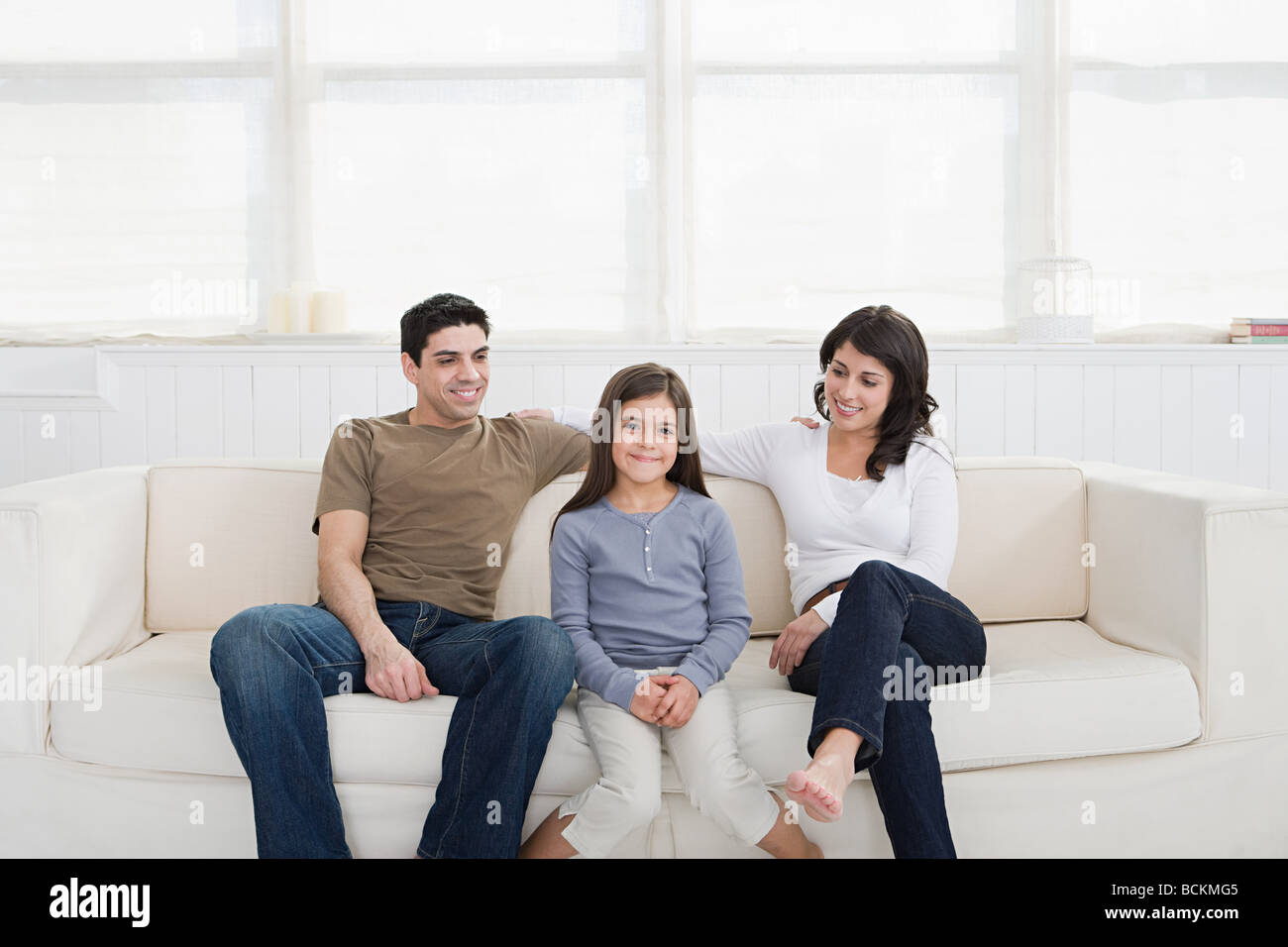 Hispanic parents with daughter Stock Photo - Alamy