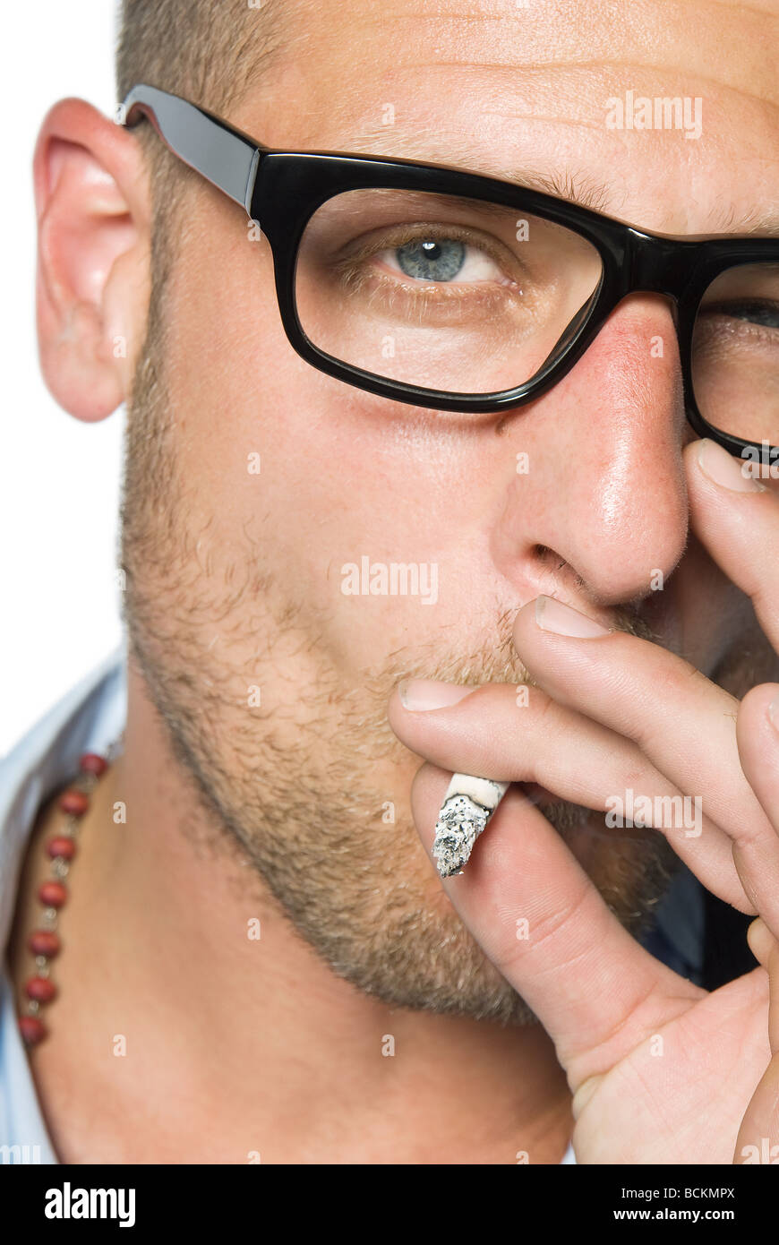 Man smoking a cigarette Stock Photo - Alamy