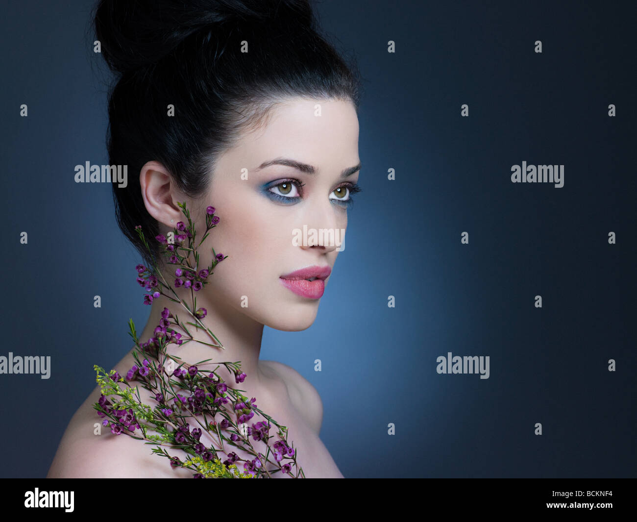 Young woman with flowers Stock Photo - Alamy