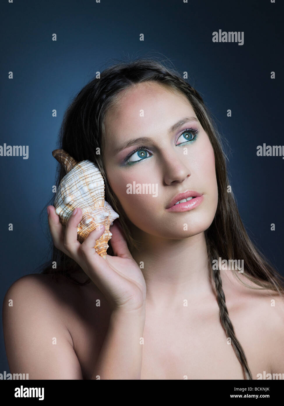 Girl with seashell Stock Photo - Alamy