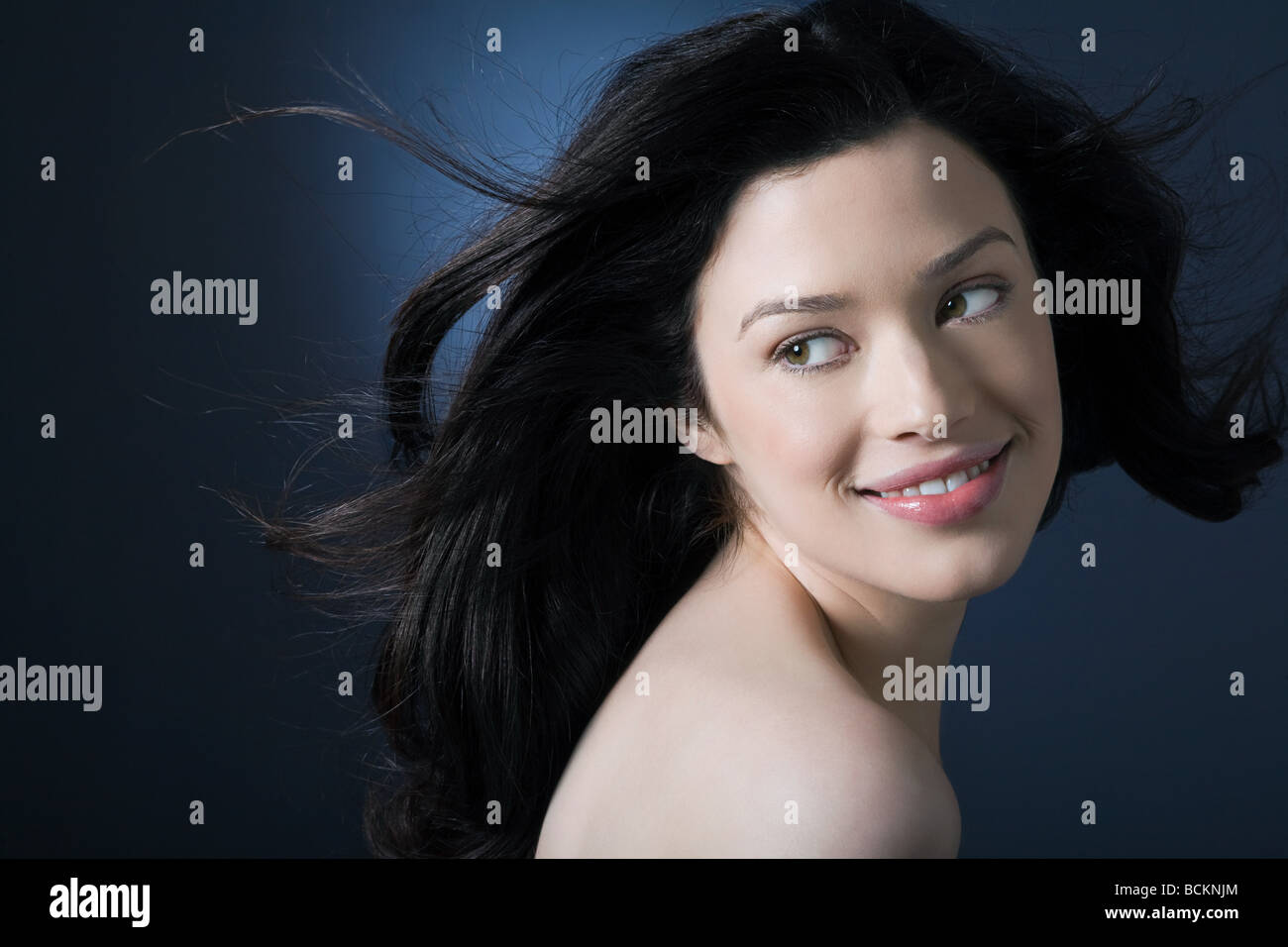 Woman with movement in hair Stock Photo - Alamy
