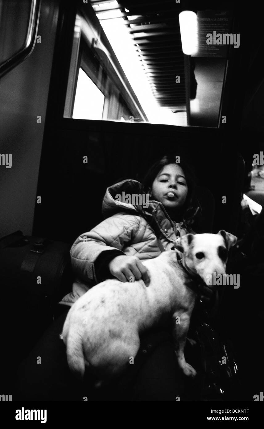 Child and dog in train, b&w Stock Photo - Alamy