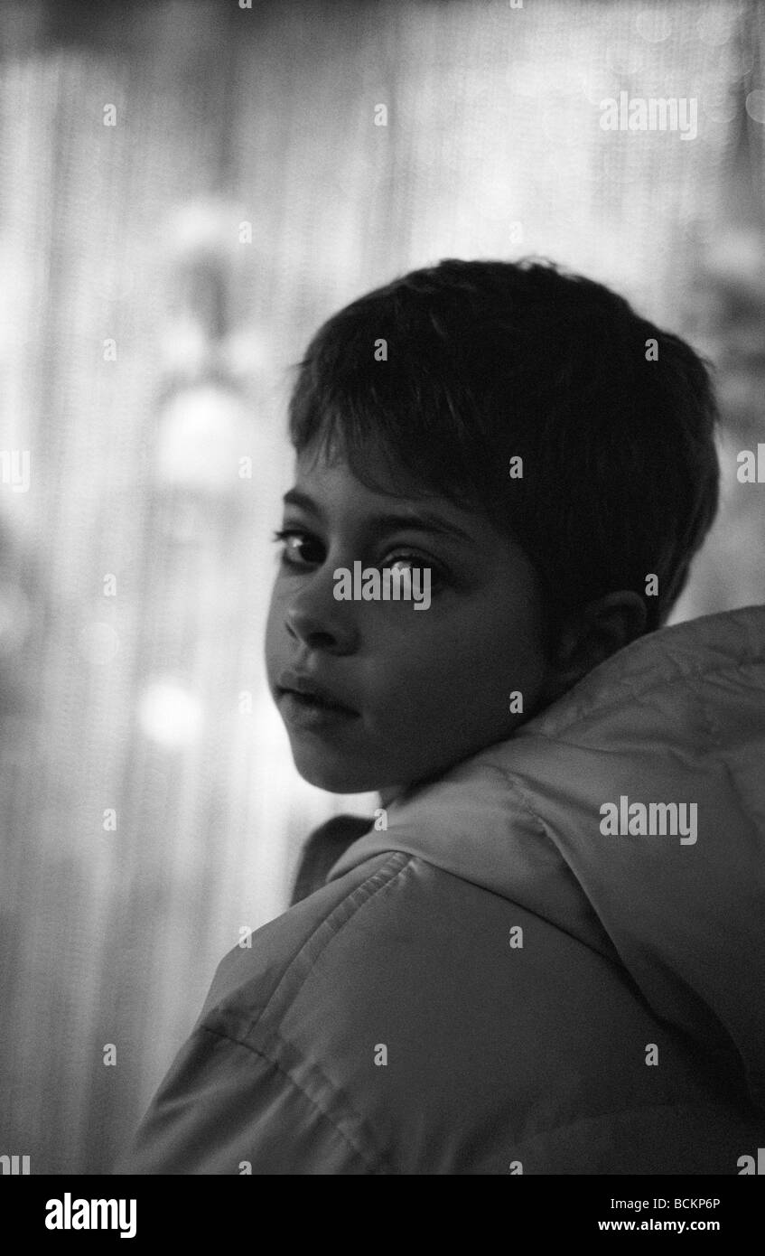 Child looking over shoulder at camera, b&w Stock Photo - Alamy