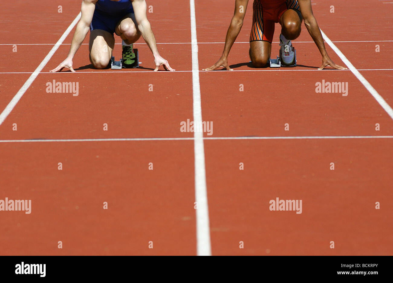 Runners in starting position, low section Stock Photo - Alamy