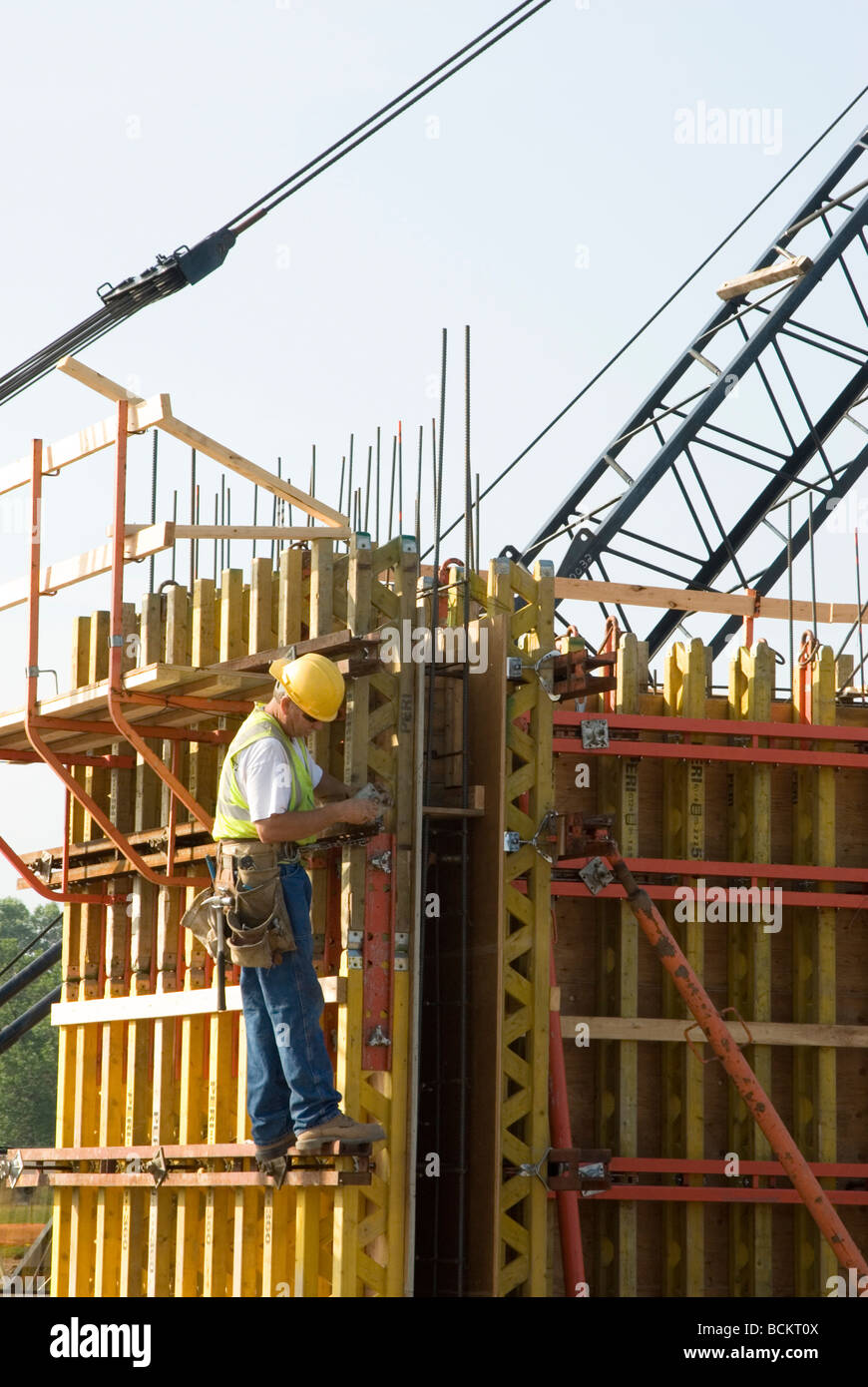 construction worker assembling forms for a concrete wall Stock Photo ...