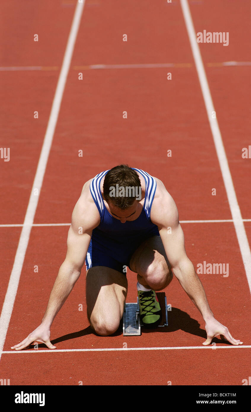 Runner at starting line, front view Stock Photo - Alamy