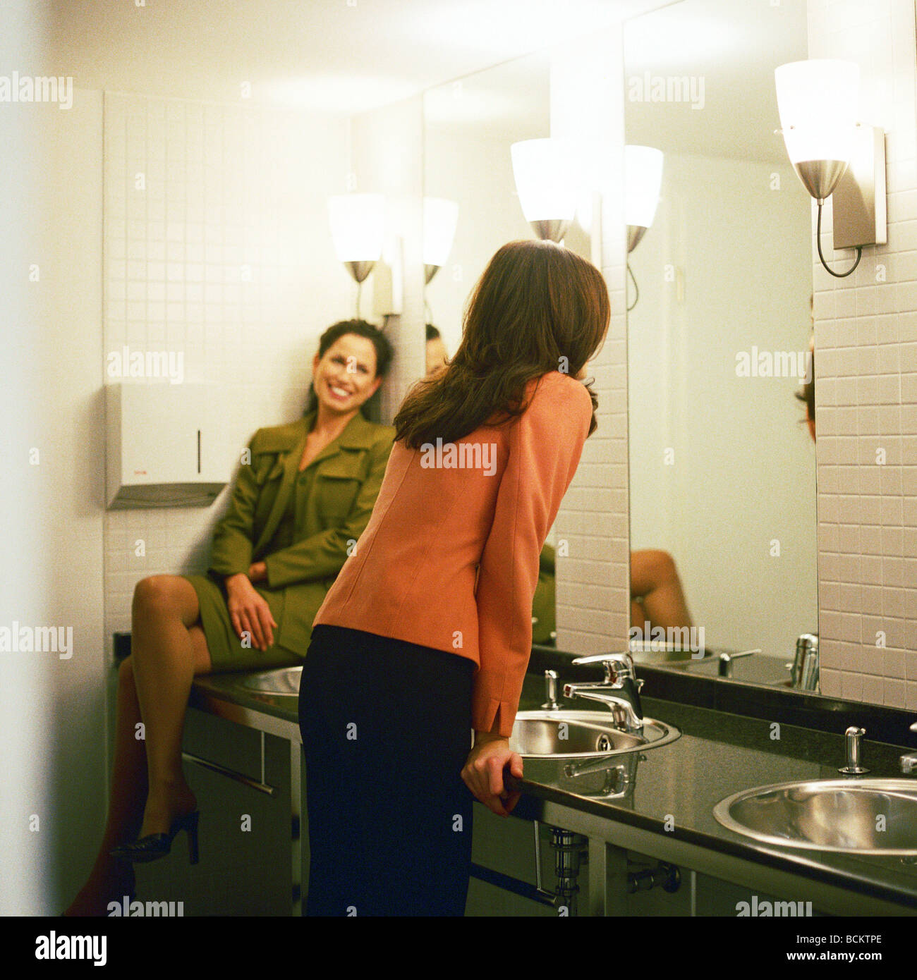 Businesswomen in restroom Stock Photo - Alamy