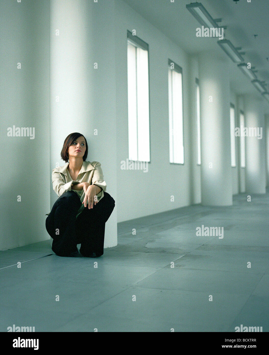 Woman crouching down isolated hi-res stock photography and images - Alamy