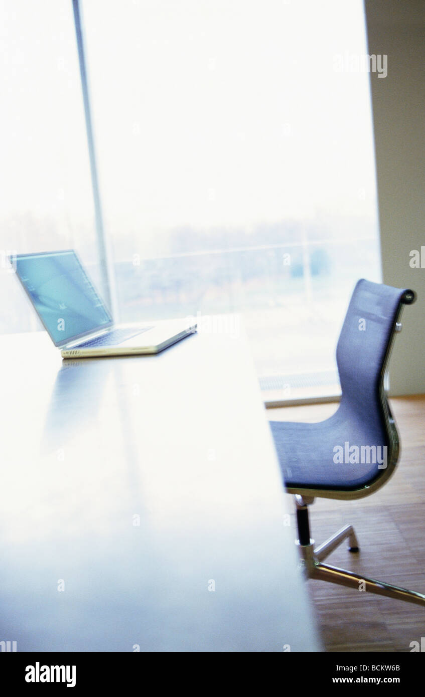 Chair at desk and laptop Stock Photo - Alamy