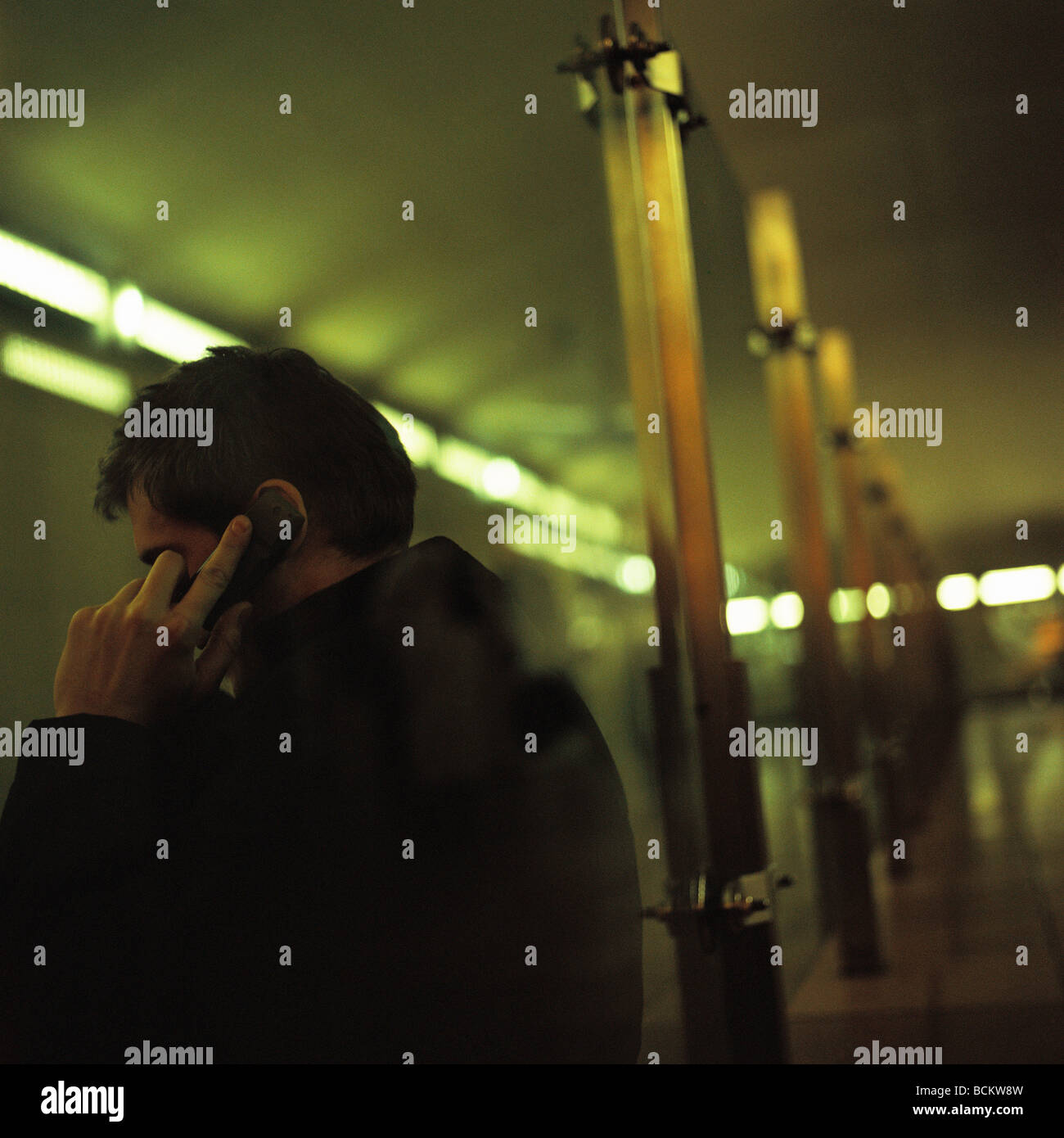 Man using cell phone in subway car Stock Photo - Alamy