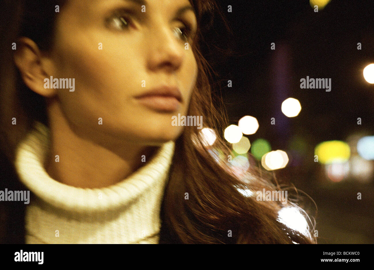 Young woman in street at night Stock Photo - Alamy