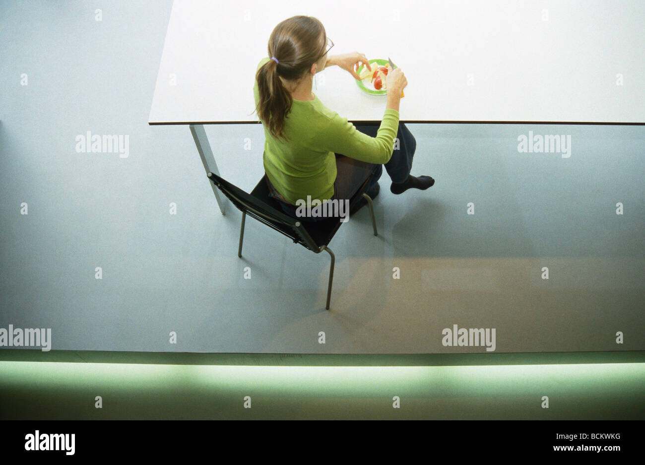 Person sitting table plate food hi-res stock photography and images - Alamy