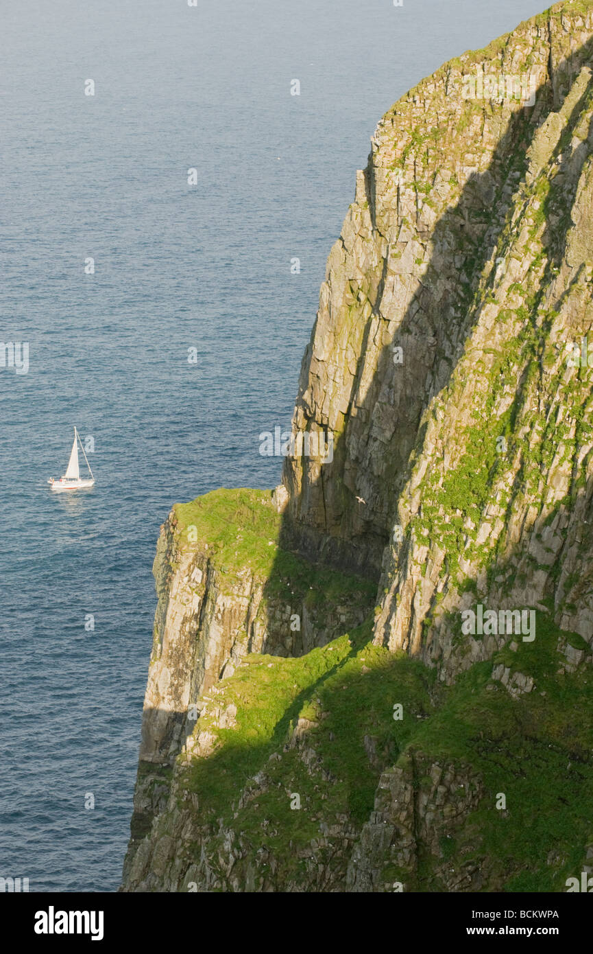 Sailboat passes below cliffs of Hirta St Kilda Scotland Stock Photo - Alamy