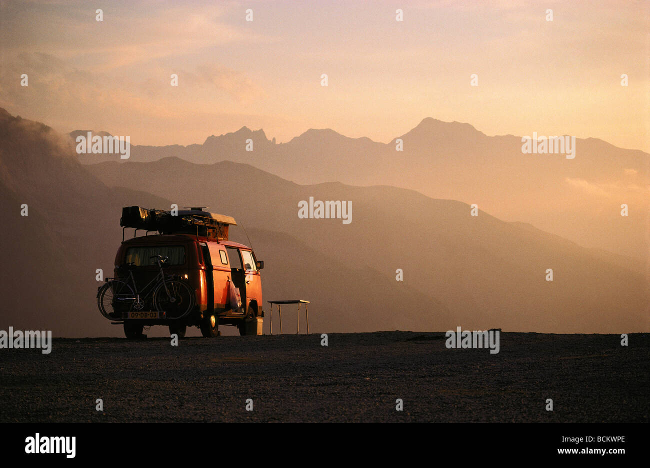 Camper van parked in front of mountains Stock Photo - Alamy