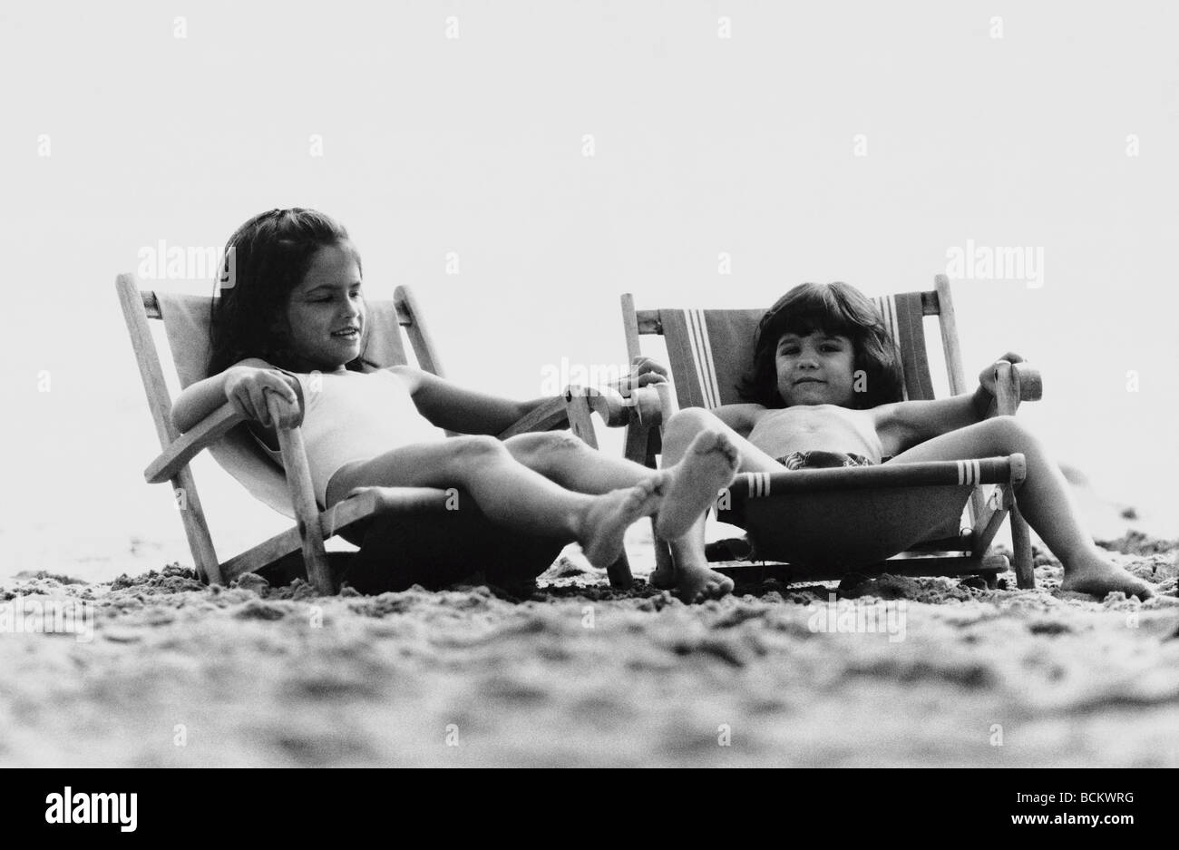 Sitting in sand Black and White Stock Photos & Images - Alamy