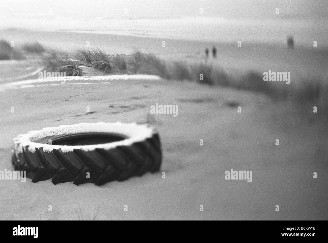 Tire in sand, b&w Stock Photo - Alamy