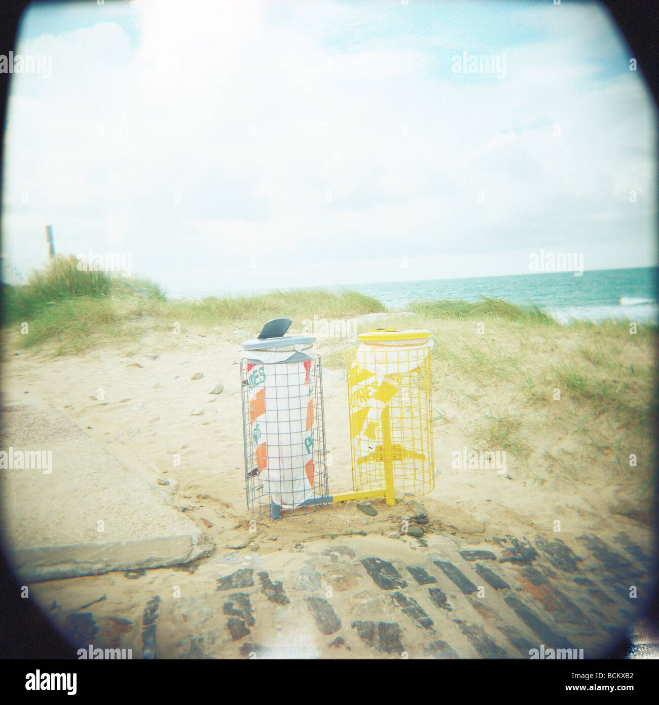 Trash containers on beach Stock Photo - Alamy
