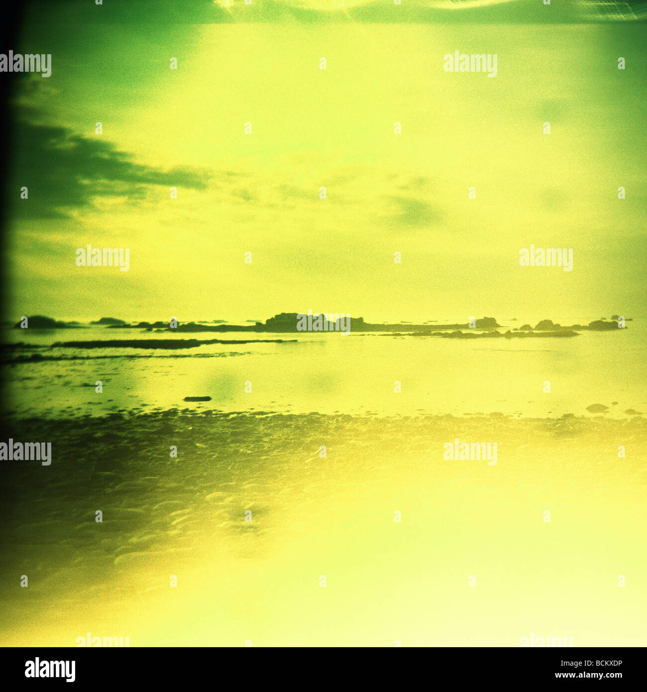 Beach, yellow toned Stock Photo - Alamy