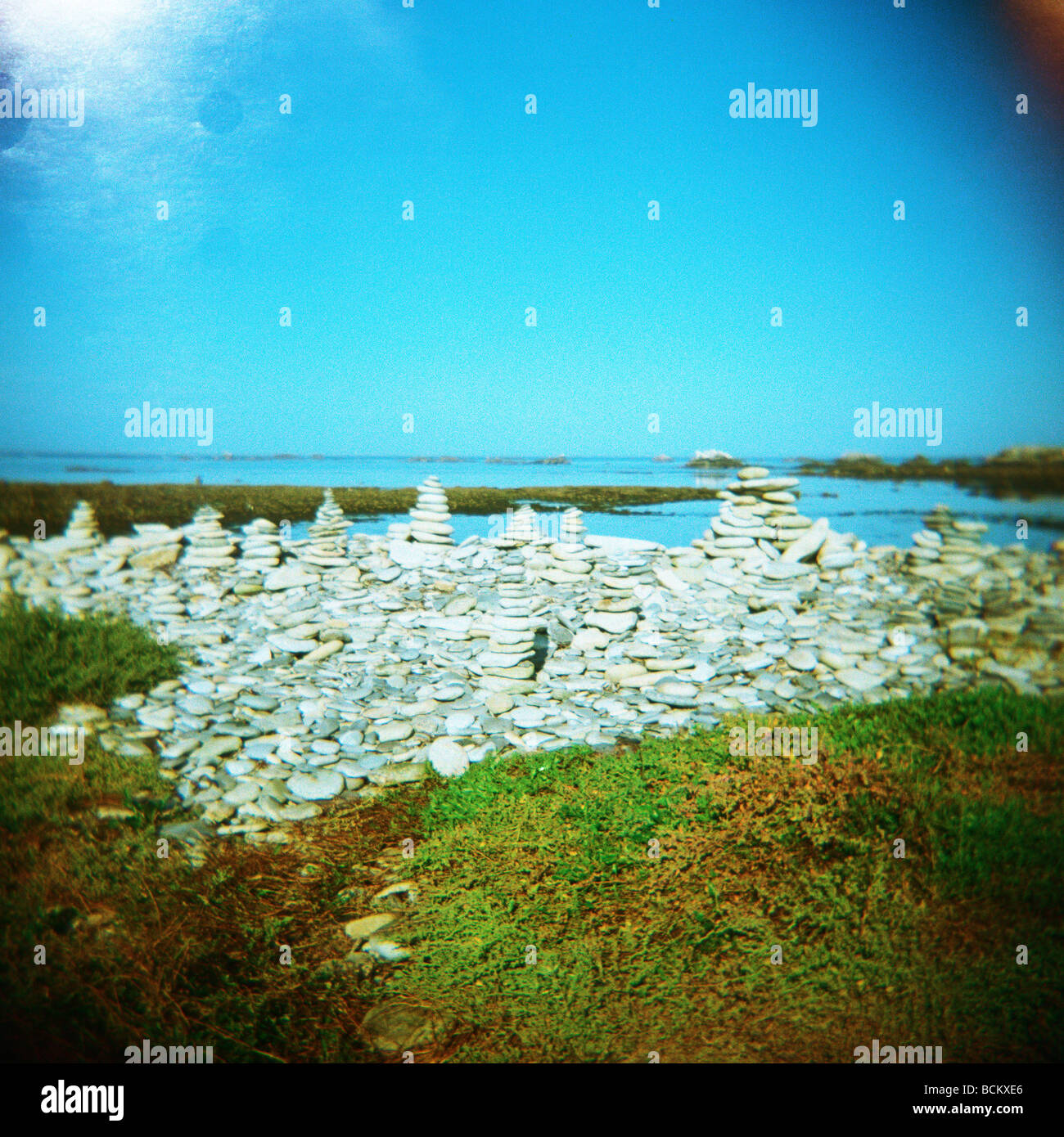 Stacks of pebbles near sea Stock Photo - Alamy