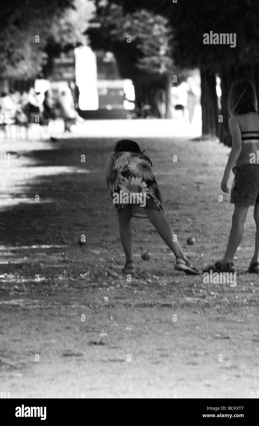 Children playing petanque in park, b&w Stock Photo - Alamy