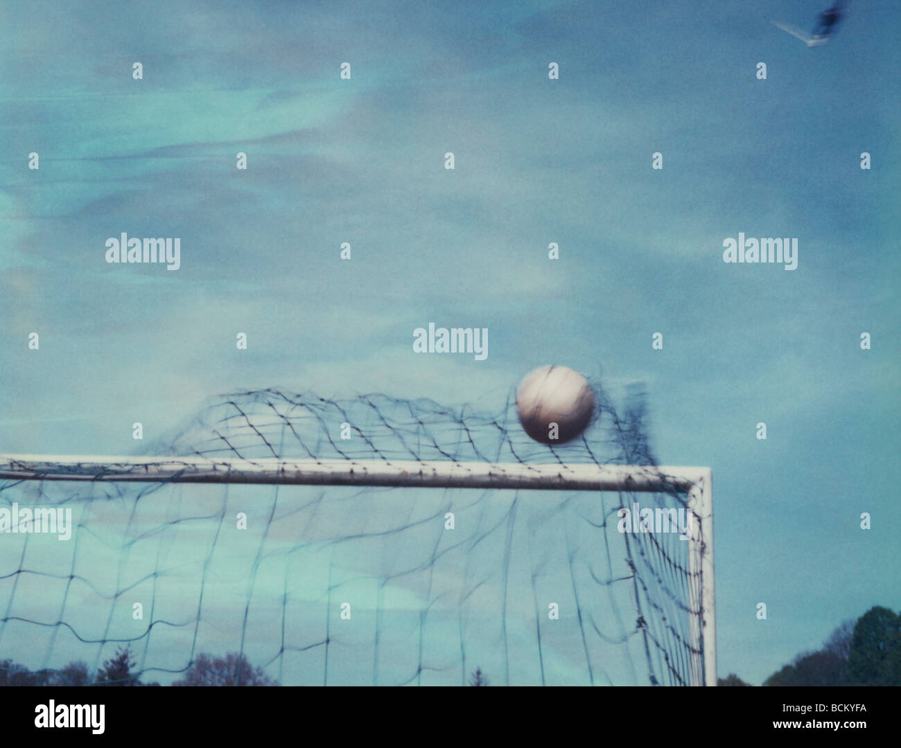 Soccer ball in goal net Stock Photo - Alamy