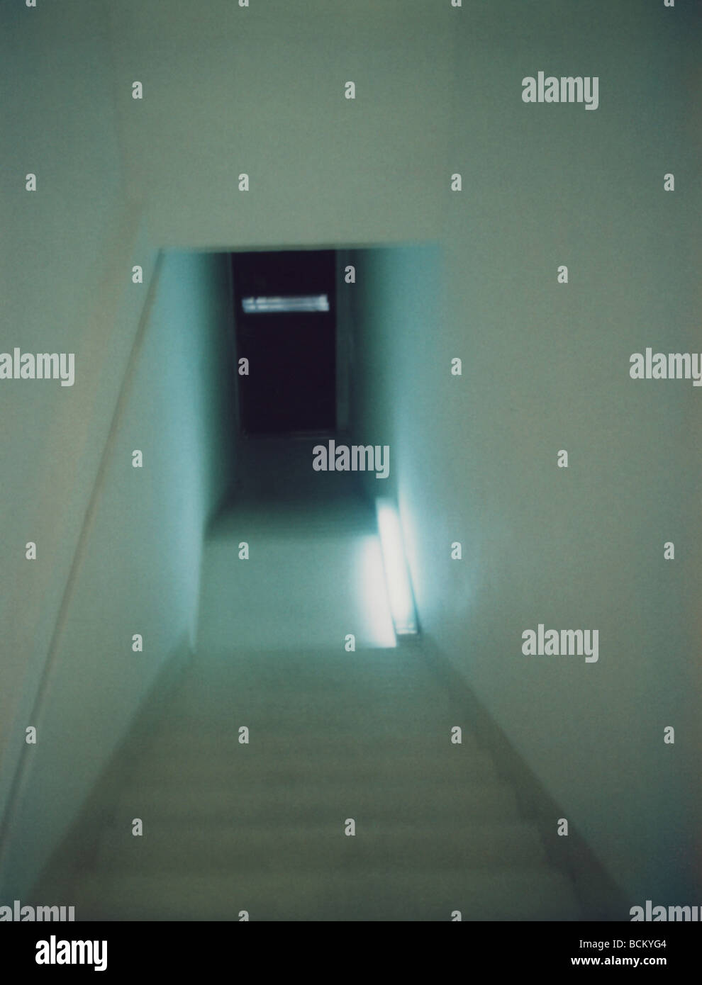 Stairway with light at bottom Stock Photo - Alamy