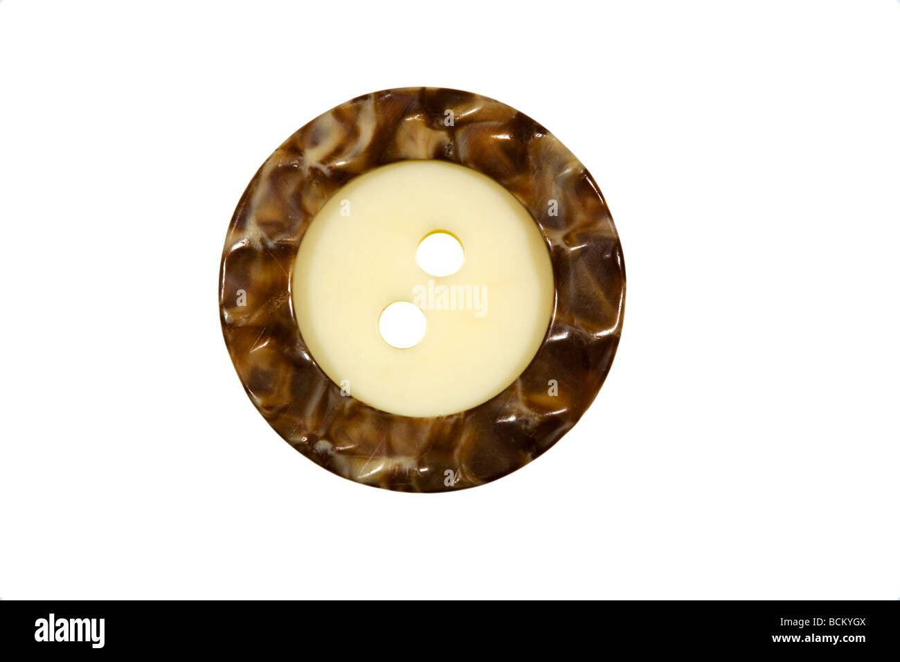 Brown white beige coloured button Stock Photo - Alamy