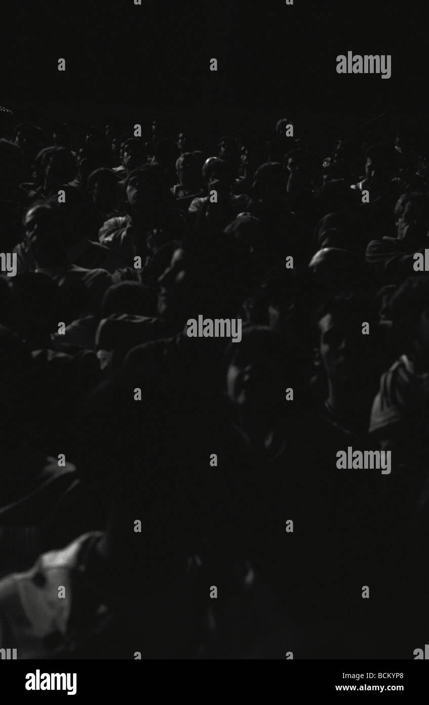 Crowd of people looking up in dark Stock Photo - Alamy