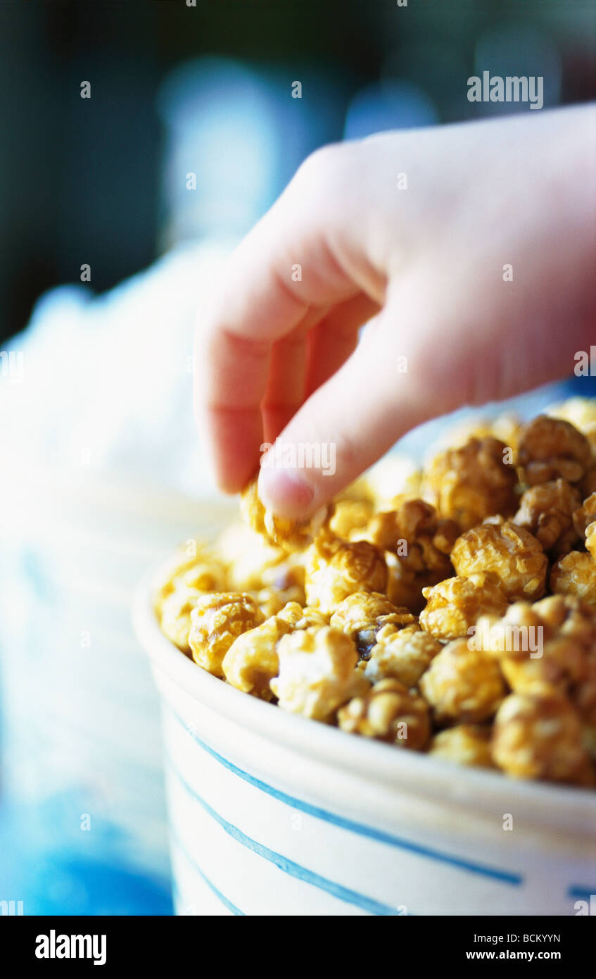 Child eating popcorn close up hand hi-res stock photography and images ...