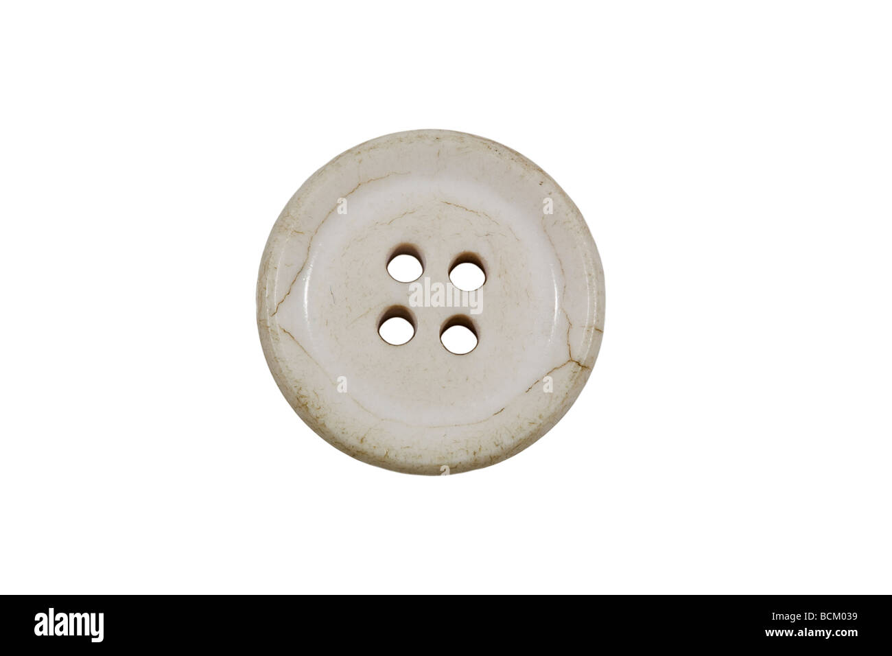 Crazed white coloured button Stock Photo - Alamy