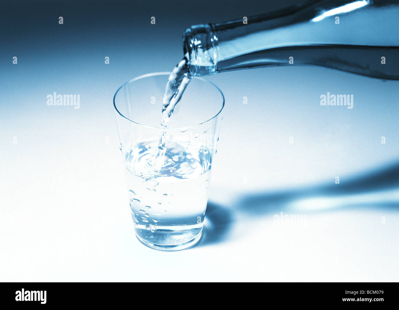 Pouring glass of water Stock Photo - Alamy