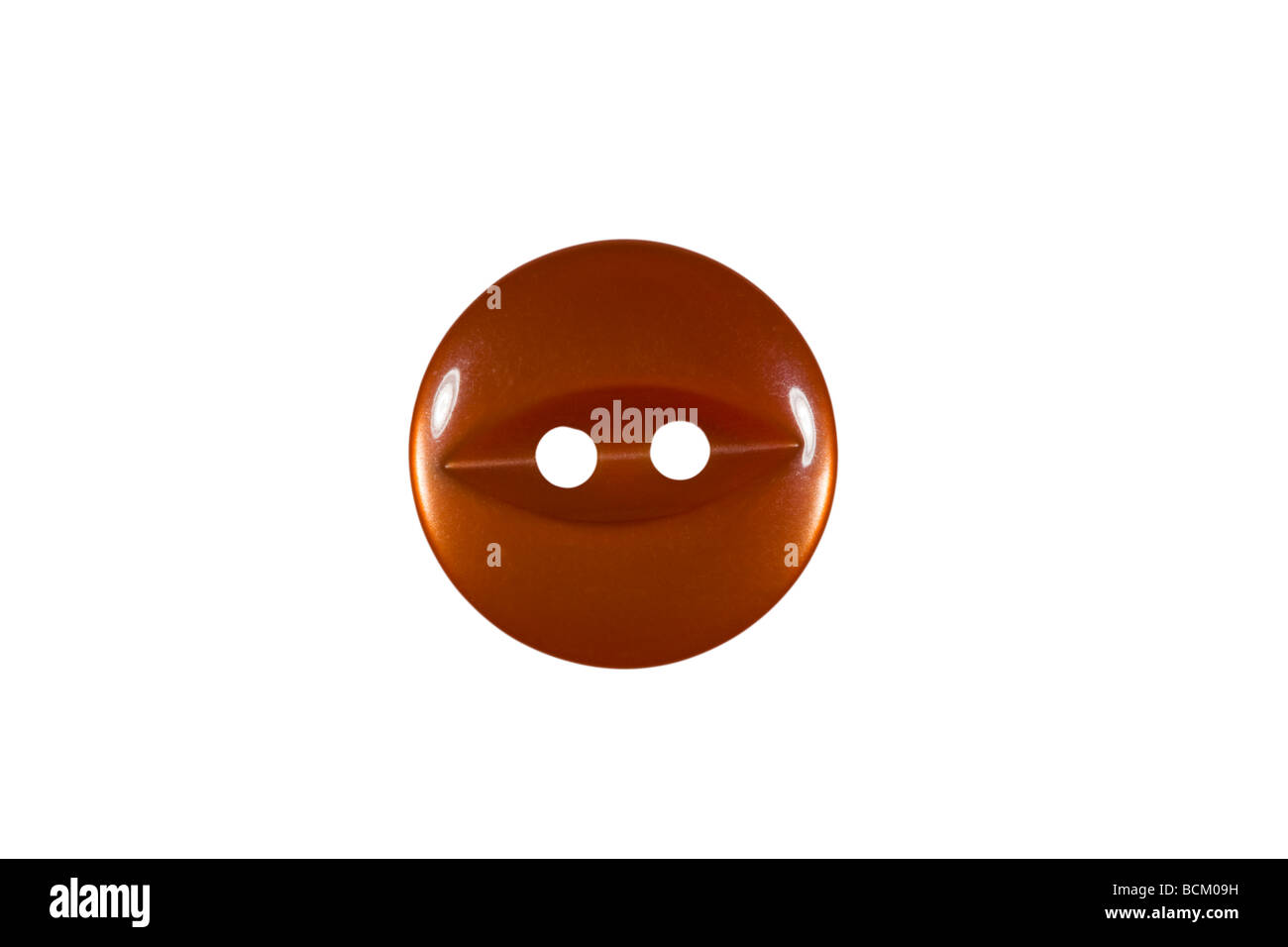 Brown orange coloured button Stock Photo - Alamy