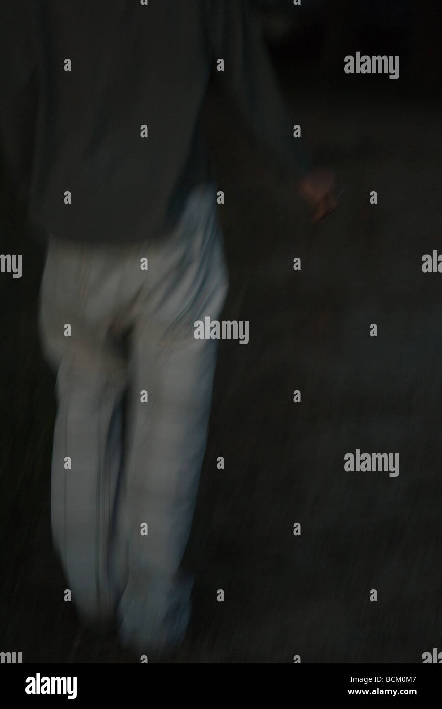 Young male standing outdoors, chest down, rear view, blurred Stock ...