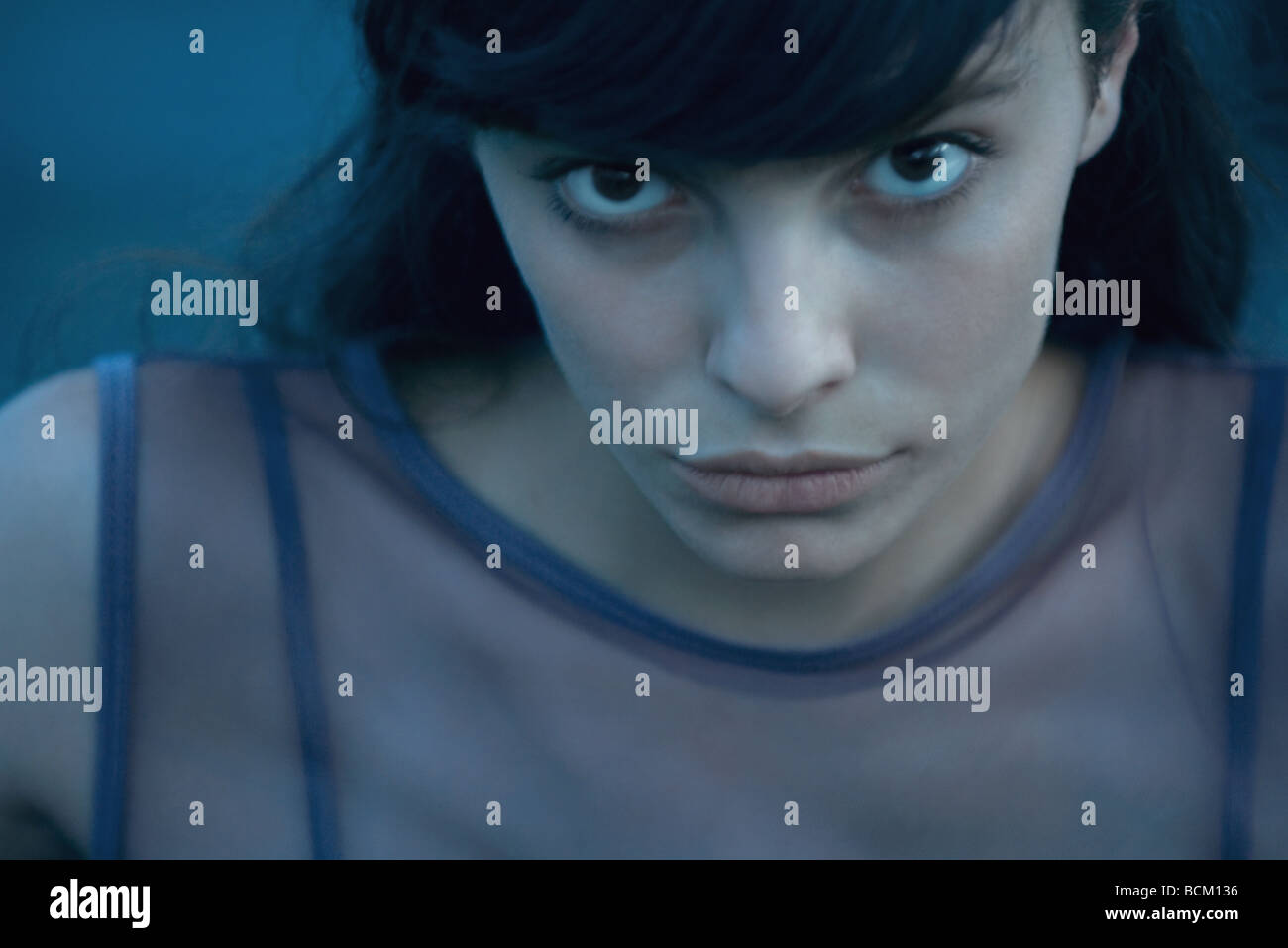 Woman looking at camera, head and shoulders, close-up Stock Photo - Alamy