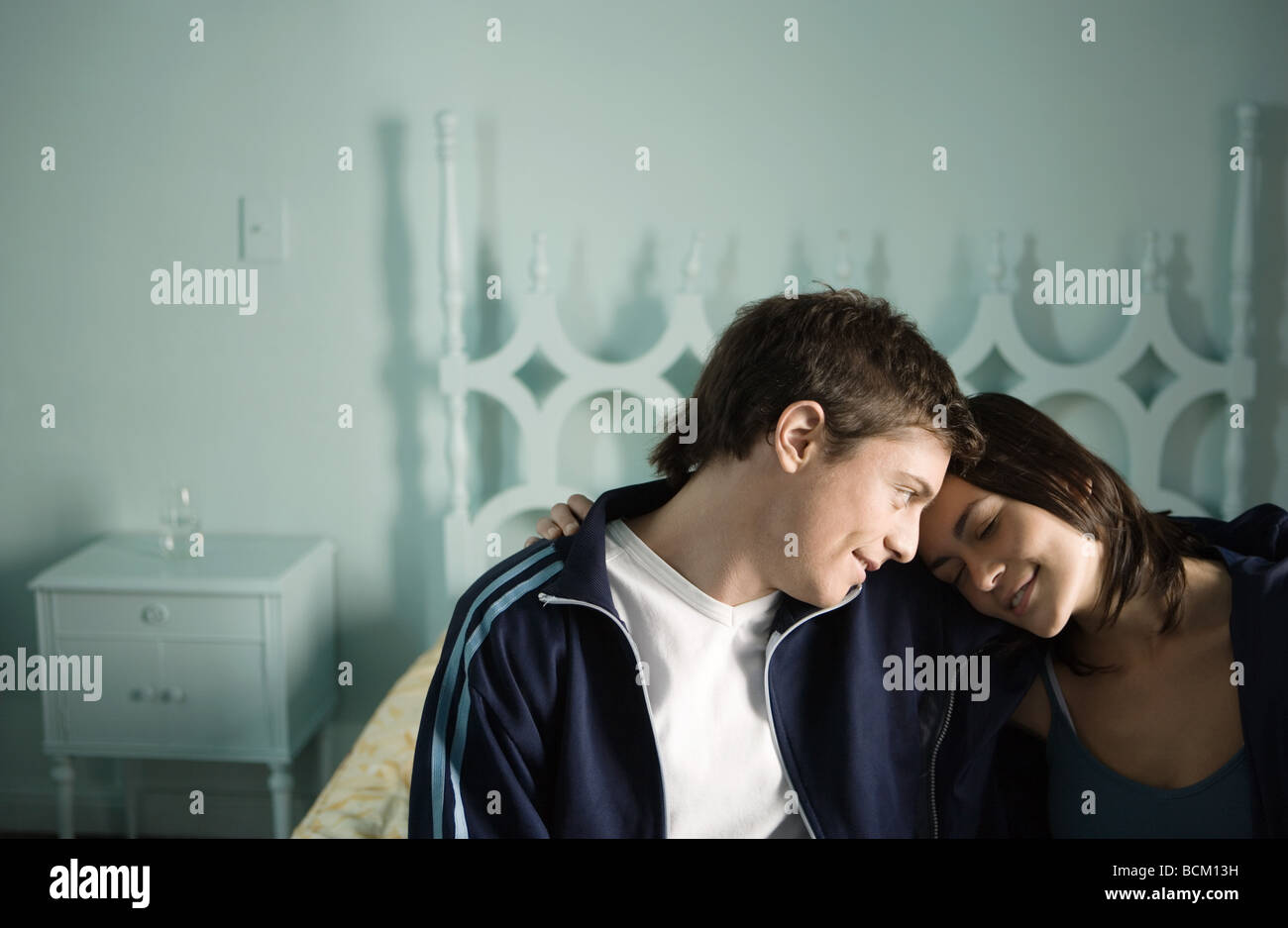 Woman sitting edge bed man hi-res stock photography and images - Alamy