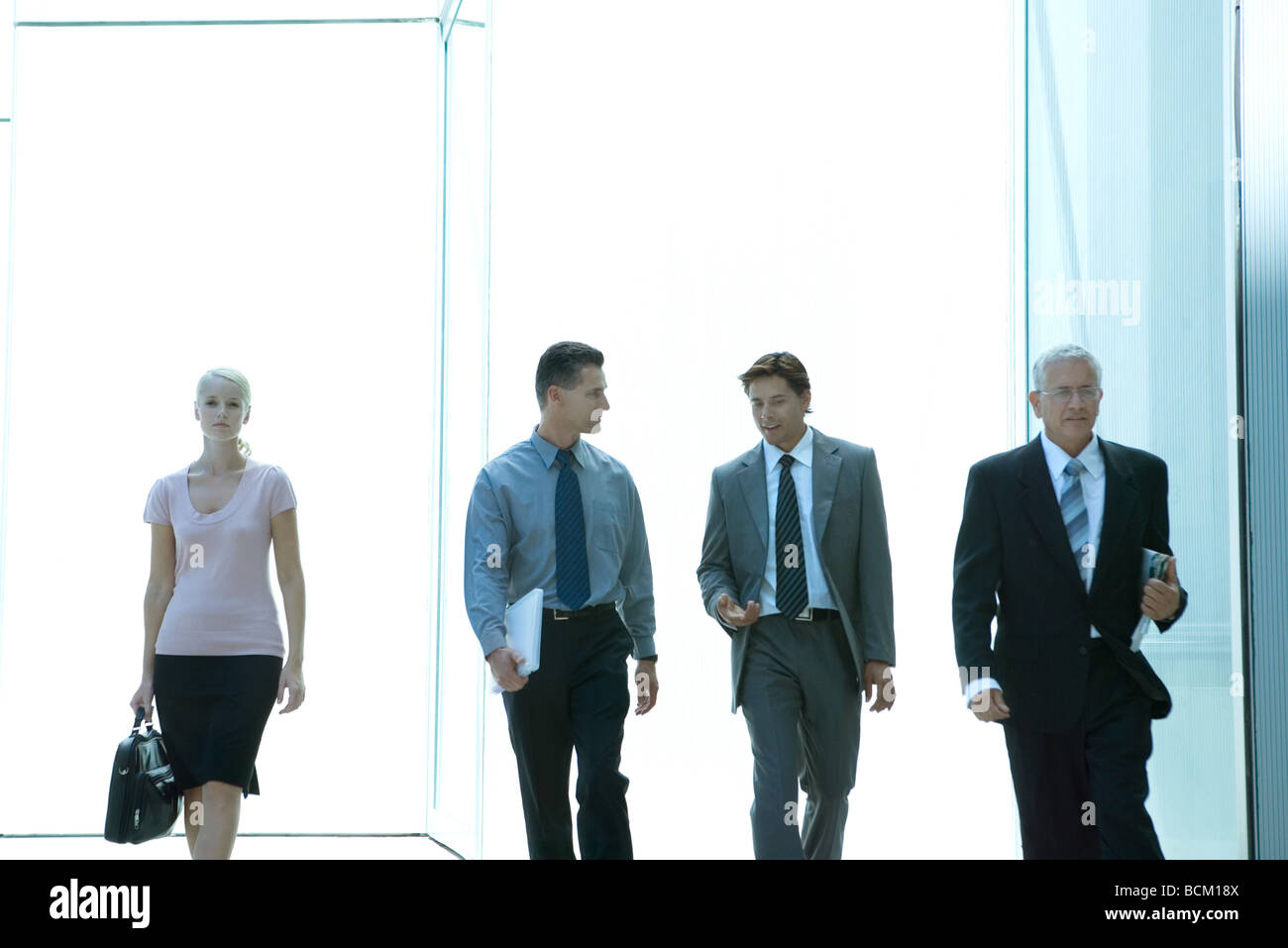 Business people walking toward camera, three quarter length Stock Photo ...