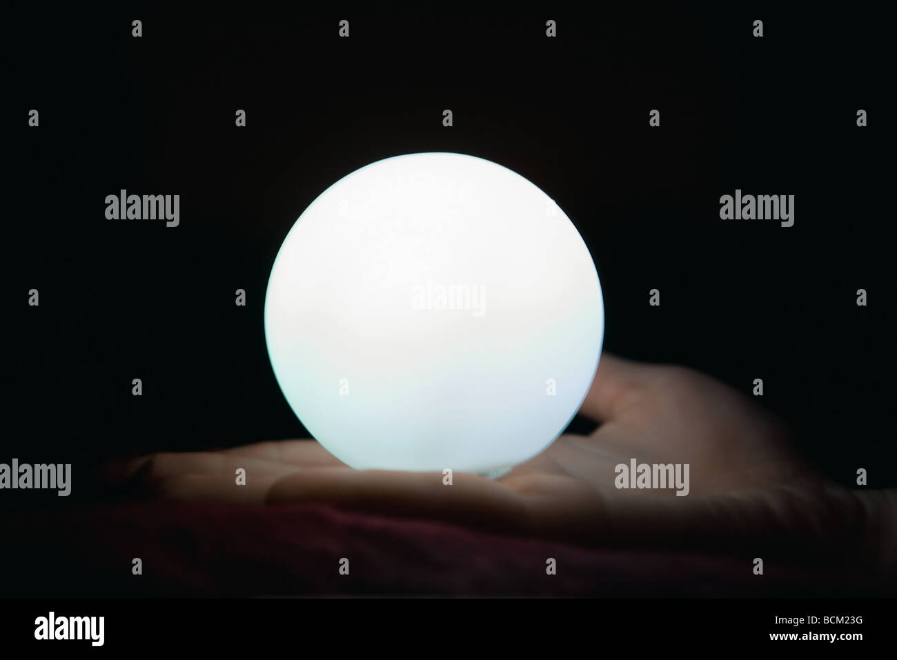 Hand holding glowing sphere, close-up Stock Photo - Alamy