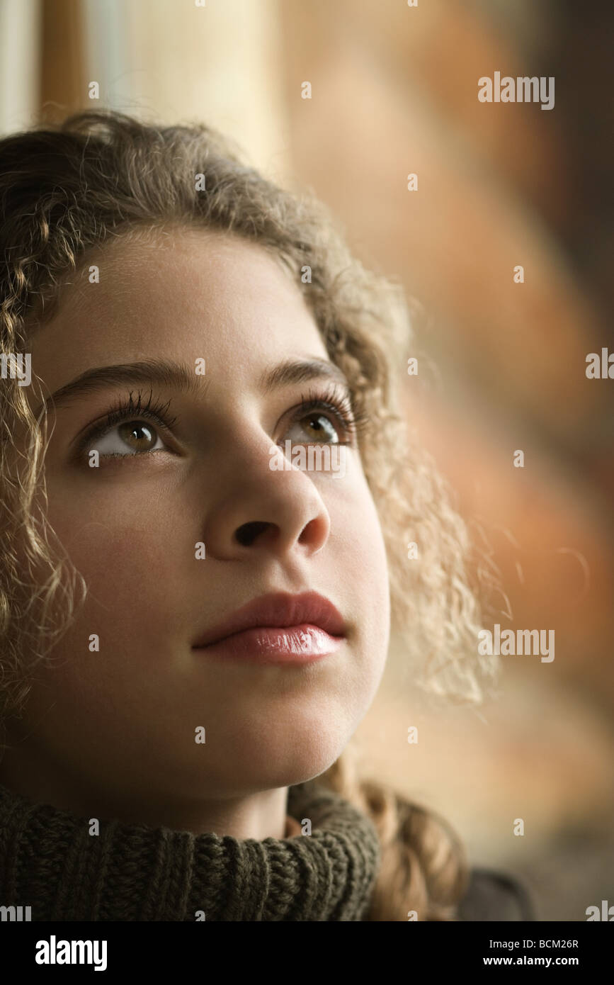 Teenage girl looking up, portrait Stock Photo - Alamy