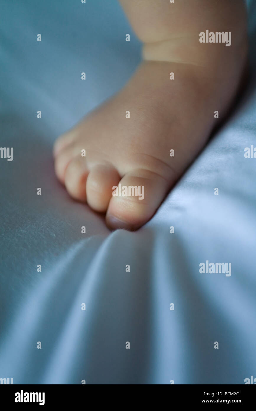 Baby standing, cropped view of one foot, close-up Stock Photo - Alamy