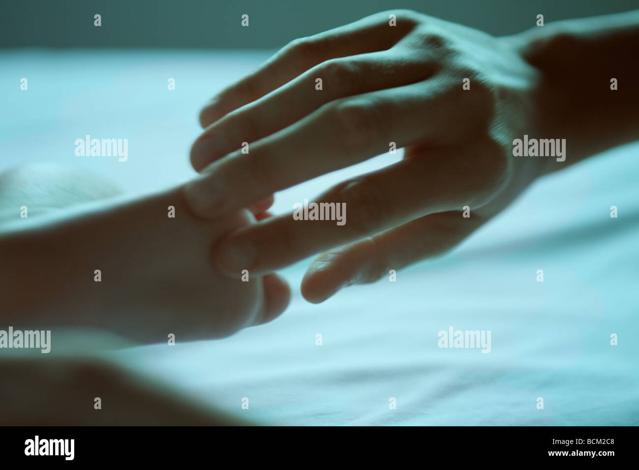 Two hands touching delicate hi-res stock photography and images - Alamy