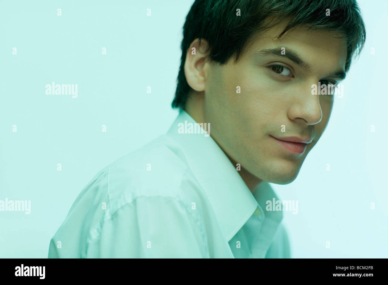 Young man glancing sideways hi-res stock photography and images - Alamy